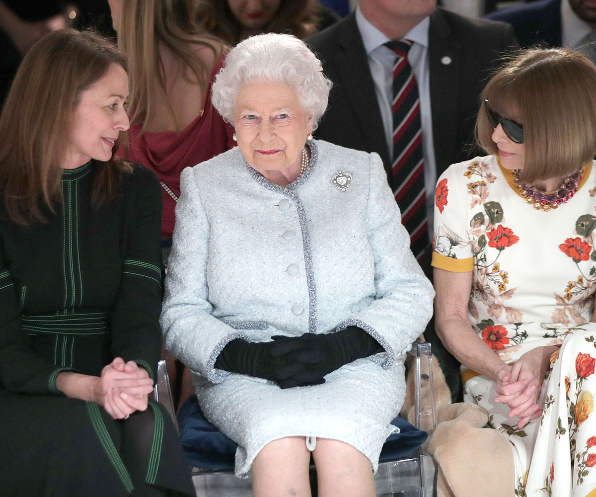 Queen makes a surprise appearance on front row at London Fashion Week ...